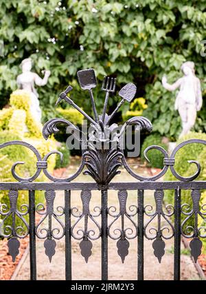 Humourous ironwork detail on one of the garden gates at Eythrope ...