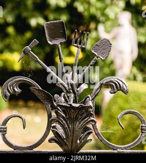 Humourous ironwork detail on one of the garden gates at Eythrope ...