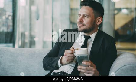 smiling bearded businessman in formal wear sitting in plane Stock Photo ...