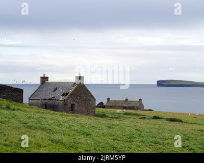 Stroma Lighthouse, abandoned houses, and the Pentland Firth Stock Photo ...