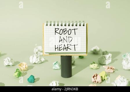 Text caption presenting Robot And Heart. Business concept Sensitivity and care behind the ...