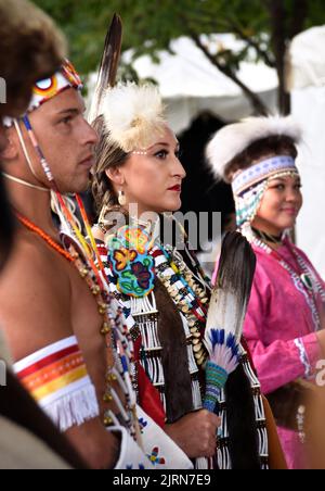 A Native American couple wait to compete in the Native Clothing Contest ...
