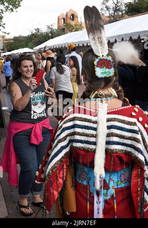Native Americans pose for photographs at the Santa Fe Indian Market in ...