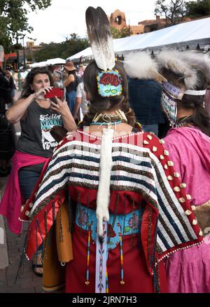 Native Americans pose for photographs at the Santa Fe Indian Market in ...