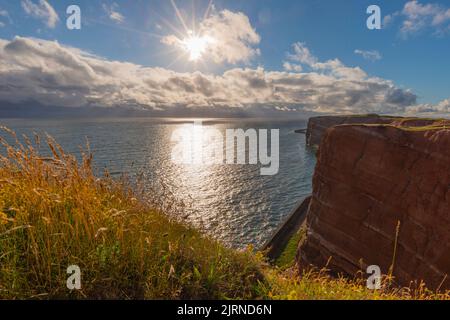 Red sandstone cliff on the high seas island Heligoland, North Sea ...