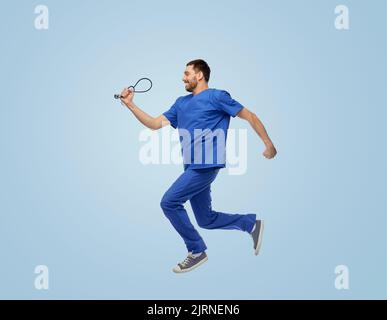 doctor or male nurse with stethoscope jumping Stock Photo - Alamy