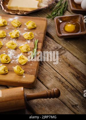 Extra close-up of a chef cook preparing a hamburger. Chefs' hands in ...