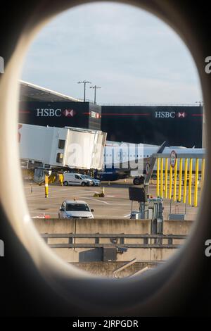 HSBC bank sponsorship adorning airport buildings, jet bridge and sky ...