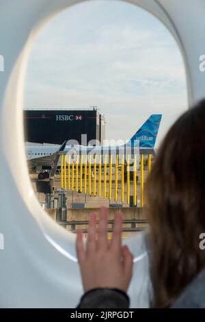 HSBC bank sponsorship adorning airport buildings, jet bridge and sky ...