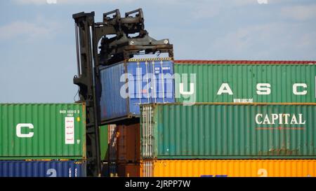 Cargo container being lifted and stacked at a rail yard near Chicago O ...