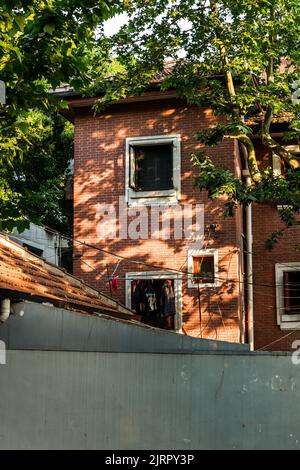 A typical Shanghai residential area with brick buildings and laundry ...