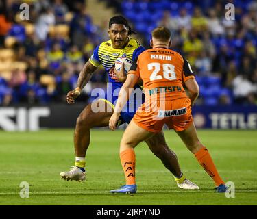 Thomas Mikaele #33 of Warrington Wolves dives over to score Stock Photo ...