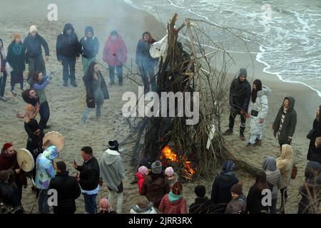 People are seen dancing around the fire. Maslenitsa (also known as ...