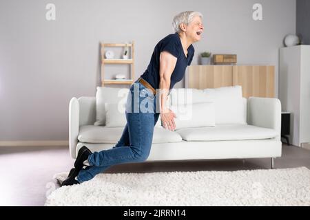 Woman Carpet Stumble Accident And Falldown In House Stock Photo - Alamy