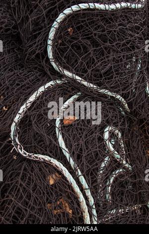 Old rope tangled with fishing nets Stock Photo - Alamy
