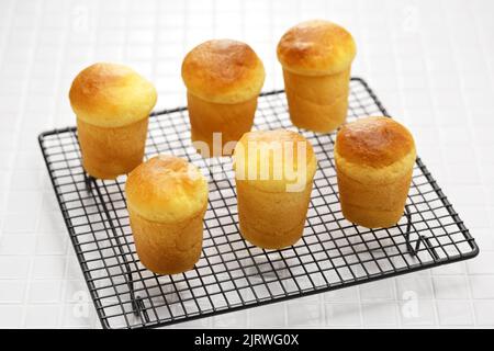 making rum baba ( baba au rhum ), traditional French & Italian dessert ...