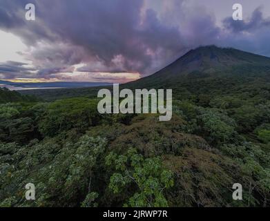 Beautiful aerial lview of Arenal Volcano, the arenal Lagoon, and rain ...