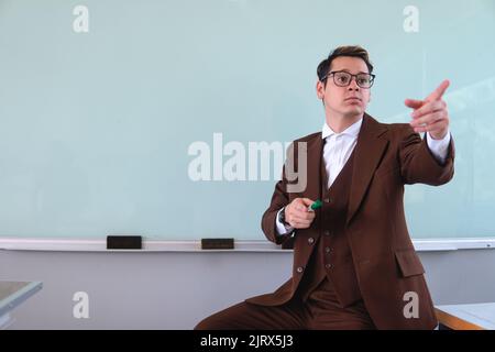 Portrait of professor giving lecture in classroom Stock Photo - Alamy