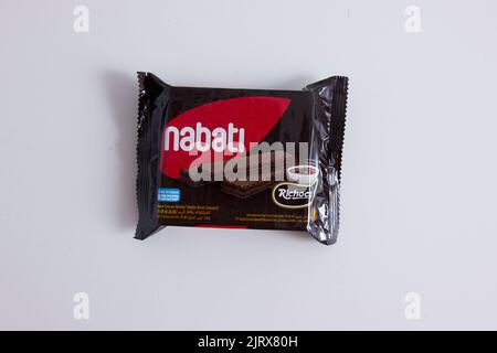 A closeup of a chocolate Nabati wafer bar on a white table background ...
