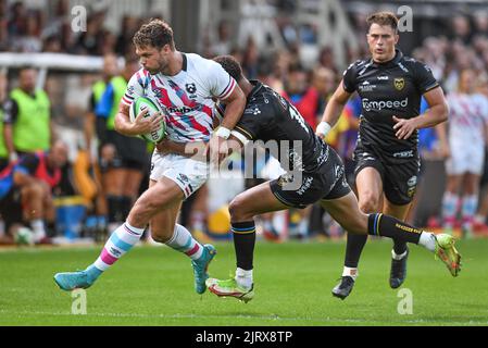 Henry Purdy of Bristol Bearsis tackled by Rio Dyer of Dragons Rugby ...