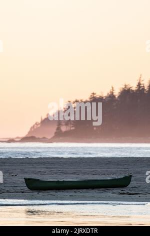 A vertical shot of a canoe on the beach of a lake, Canada Stock Photo ...