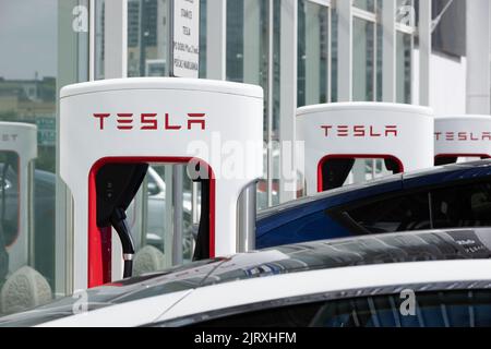 A Tesla charging station seen in front of a shopping center at Aupark ...