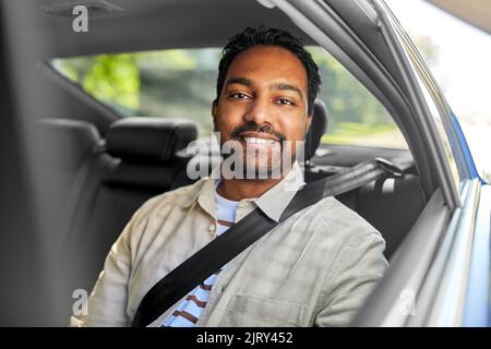 smiling indian male passenger in taxi car Stock Photo - Alamy