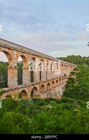 Old roman aqueduct at sunrise, Aqueeducte de les Ferreres, Devil's ...