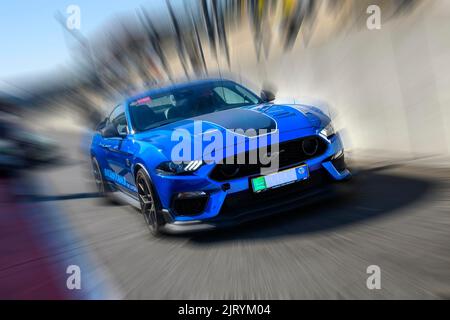 Dynamic photo with zoom effect of sports car race car BMW M4 leaving ...