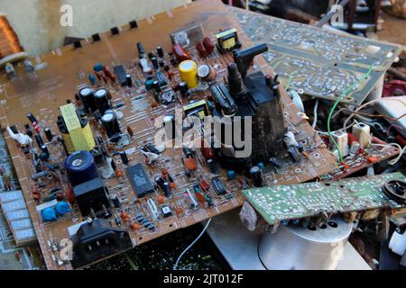 Background with old rare electronic components randomly decomposed ...