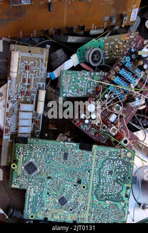 Background with old rare electronic components randomly decomposed ...
