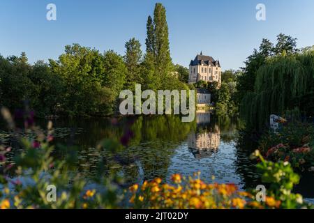 Castle Raoul with Yellow Flower and Reflection in Water in Chateauroux ...