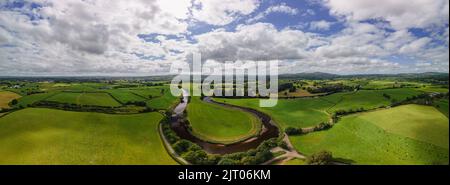 An aerial drone panoramic shot of the Cappagh Parish Church in Northern ...