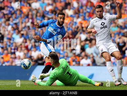 Rangers' Connor Goldson shoots under pressure from Ross County ...
