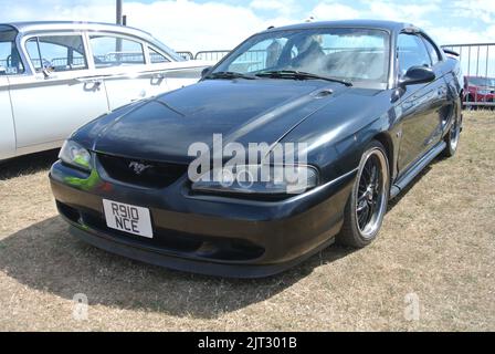 A 1998 Ford Mustang GT parked on display at the English Riviera classic ...