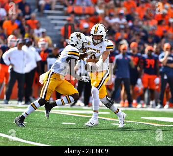 Wyoming Cowboys quarterback Andrew Peasley (6) hands off to running ...