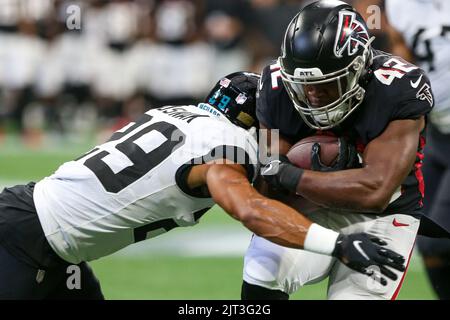 Atlanta Falcons running back Caleb Huntley (42) is stopped by Tampa Bay ...