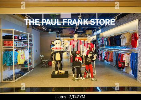 SINGAPORE - CIRCA JANUARY, 2020: clothes on display at Uniqlo store in Singapore Changi Airport ...