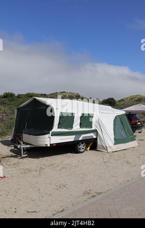 an old folding caravan on a campsite Stock Photo - Alamy