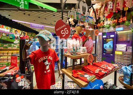 SINGAPORE - CIRCA JANUARY, 2020: clothes on display at Uniqlo store in Singapore Changi Airport ...