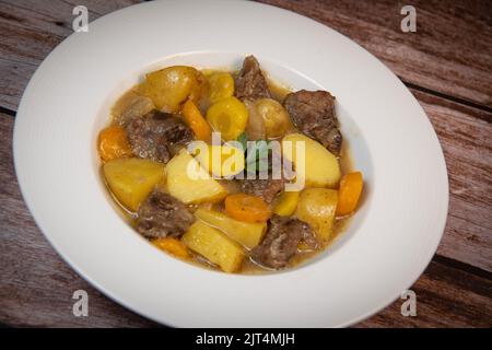 Recipe for beer and mustard beef chuck stew with potatoes, turnips and ...