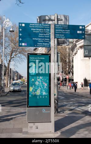 Tourist Sign, Dublin, Eire. Bilingual sign giving directions to some of ...