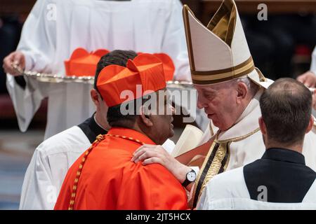 New Cardinal Anthony Poola receives the red three-cornered biretta hat ...
