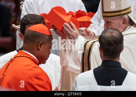 New Cardinal Peter Ebere Okpaleke receives the red three-cornered ...