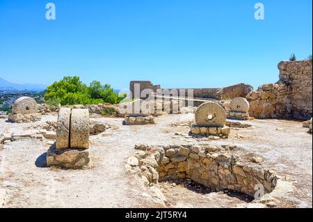 Stone wheels which are remains of an old bakery. The ruined medieval ...