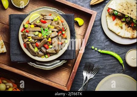 Arabic cuisine; Traditional Egyptian liver and sausage pasta dishes ...