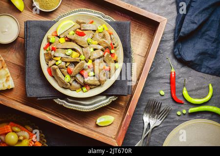 Arabic cuisine; Traditional Egyptian liver and sausage pasta dishes ...