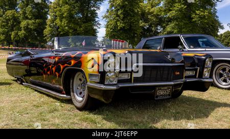 1968 Cadillac DeVille with a stunning custom flame paint job on display ...