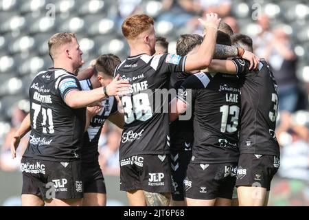 Jordan Lane #13 of Hull FC runs at Ethan Havard #19 of Wigan Warriors ...