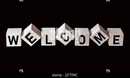 Welcome and support symbol. The concept word Welcome on wooden cubes ...